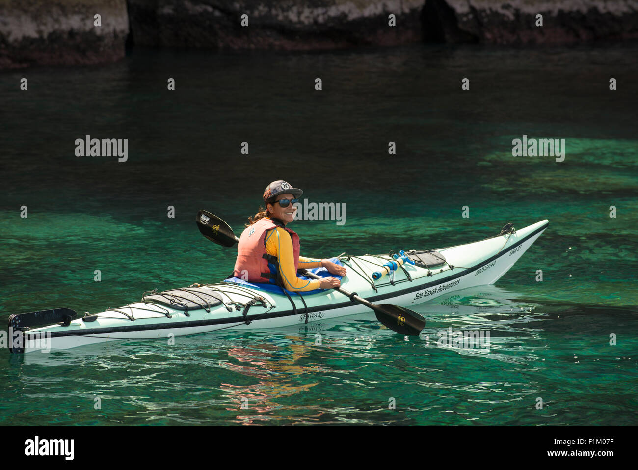 Mexico, Baja, Lapaz, Espiritu Santo. Woman kayaking through caves Stock ...