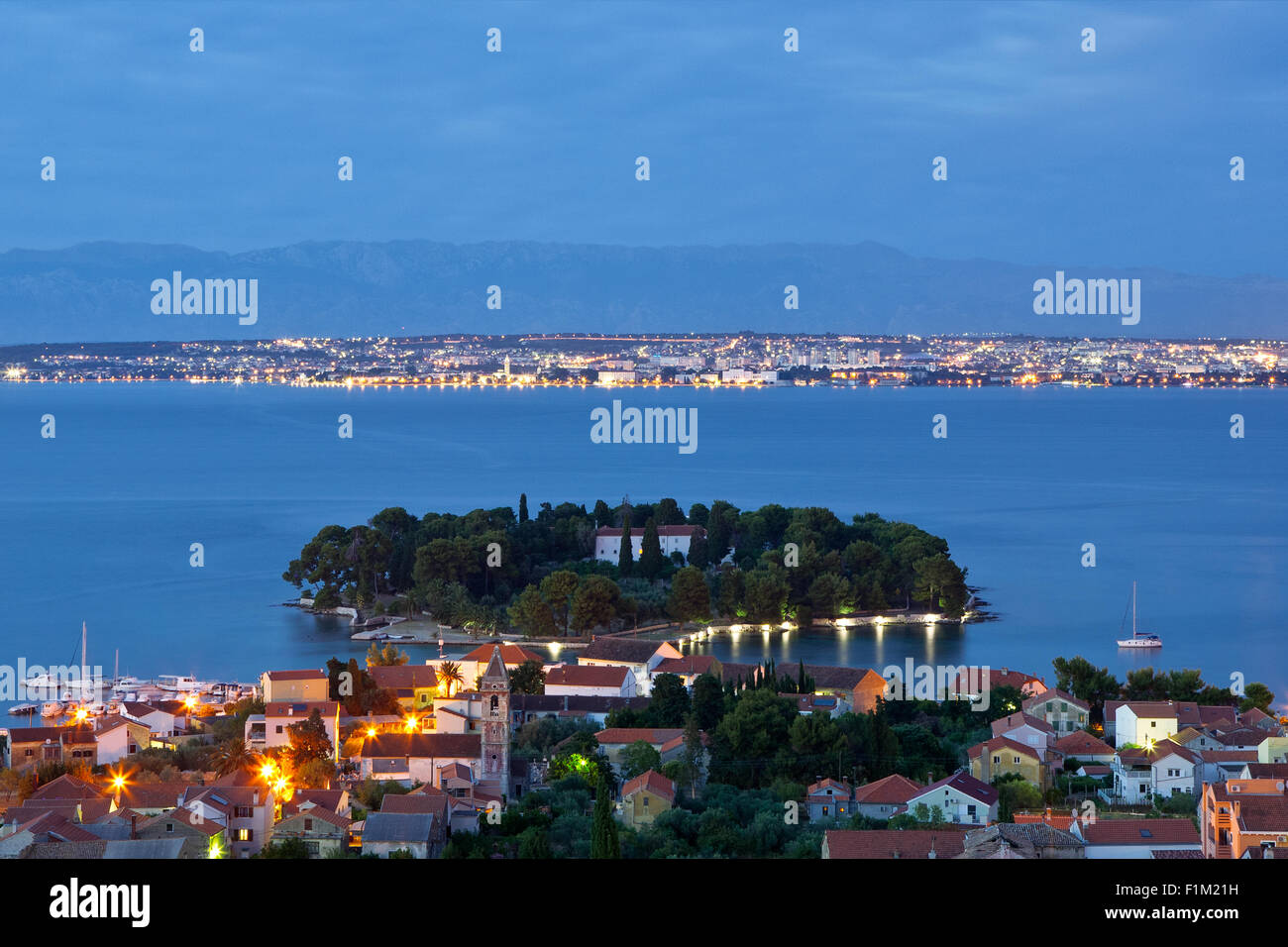 Preko and Zadar in evening blue hour seen from island Ugljan, Dalmatia ...