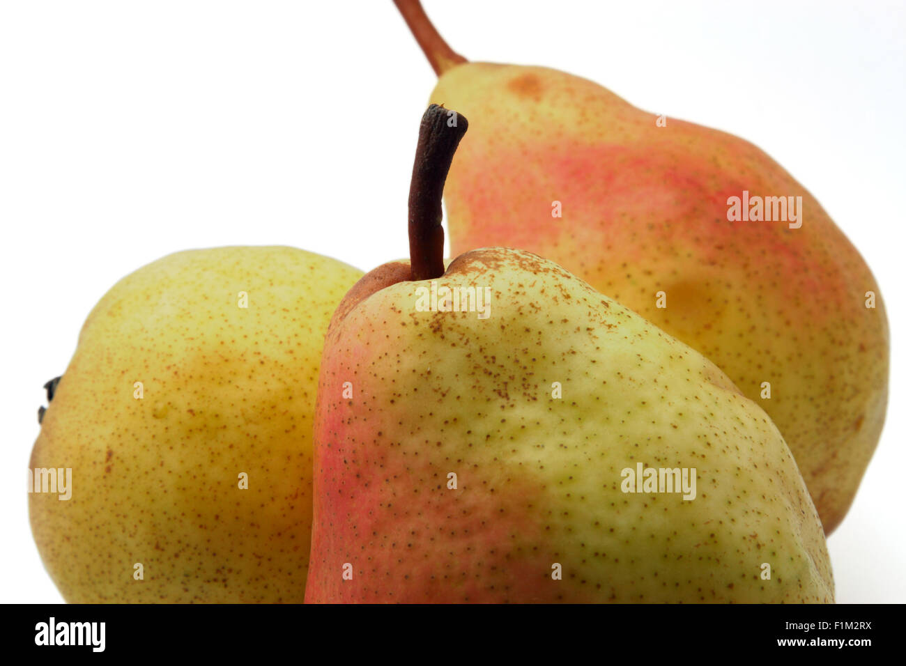 Three ripe pears isolated on white background Stock Photo - Alamy