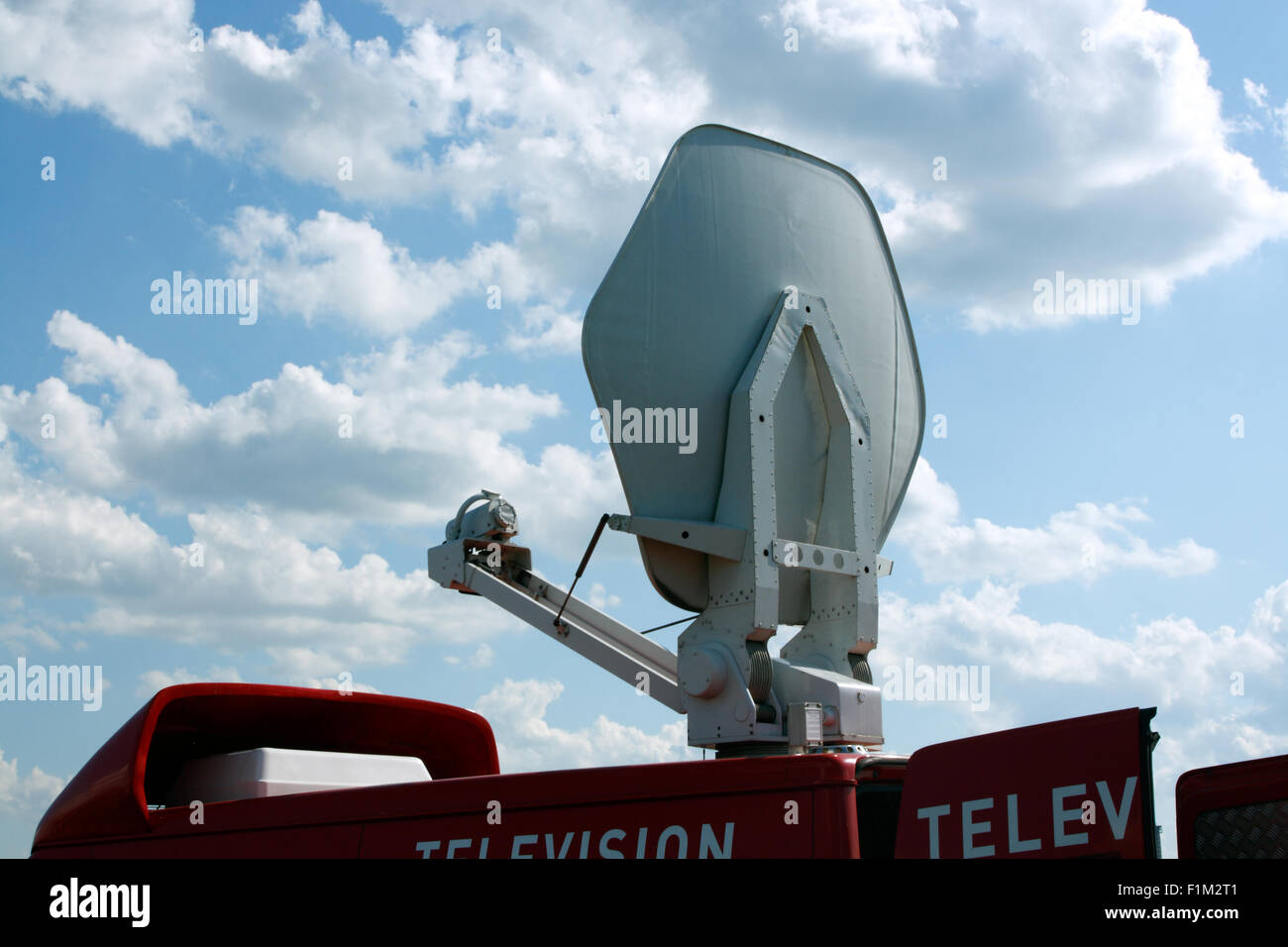 Television vehicle with parabolic antenna on the roof Stock Photo - Alamy