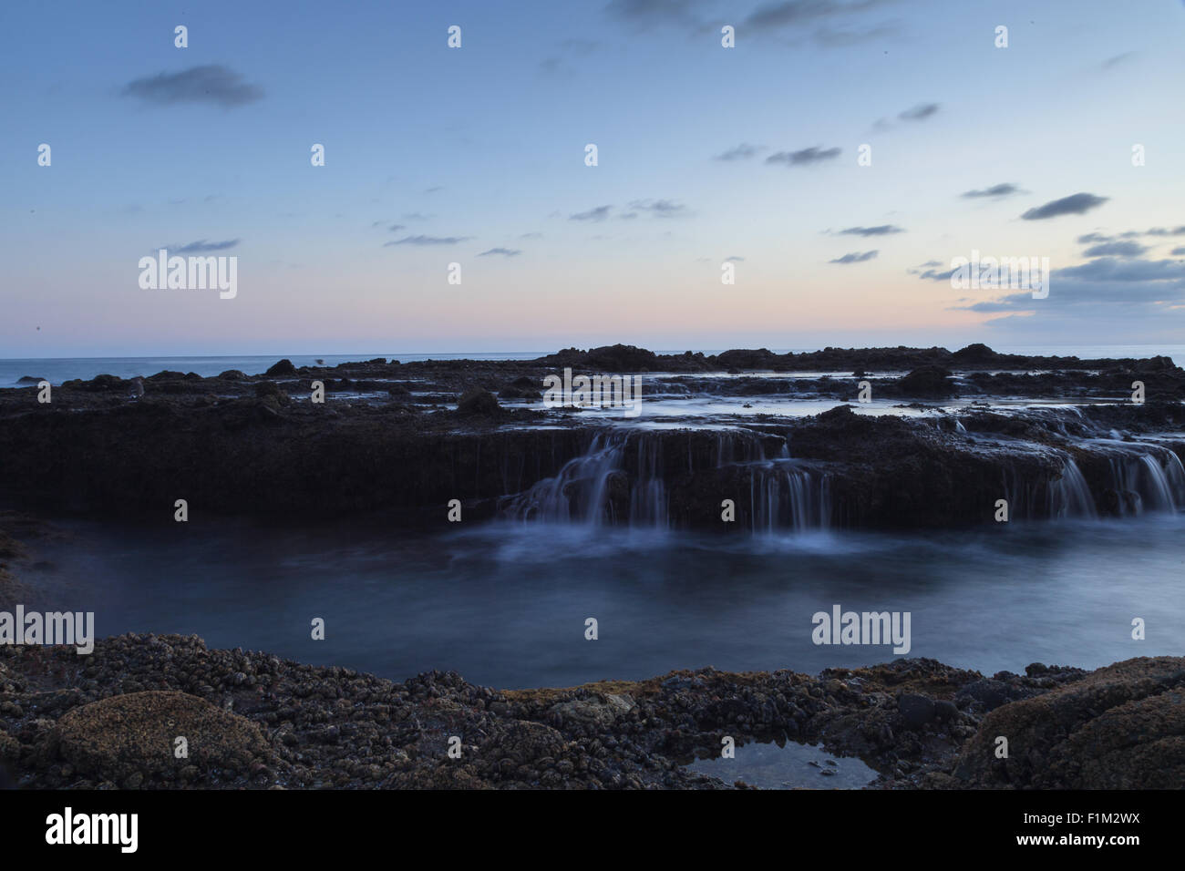Panoramic of Victoria beach rocks with water flowing into the ocean at ...