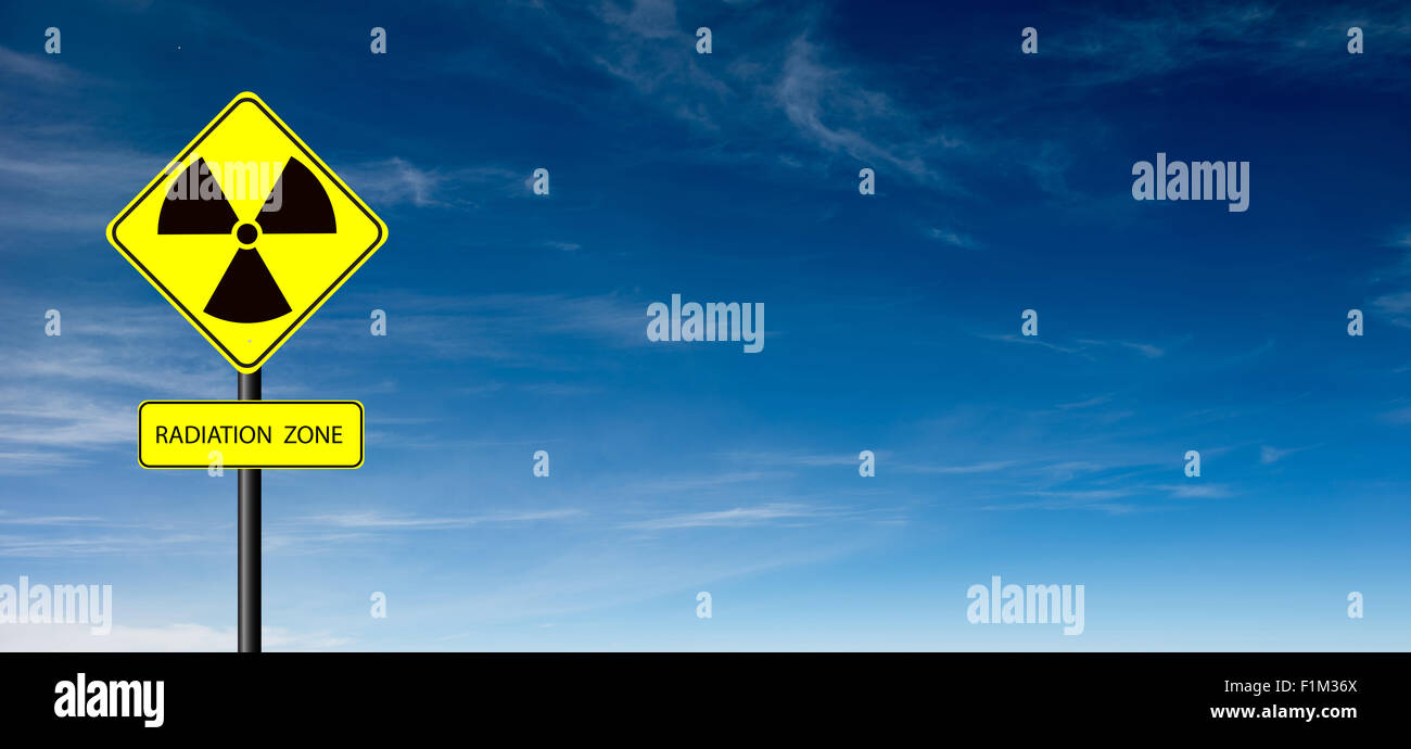 nuclear radiation warning symbol with blue sky Stock Photo - Alamy