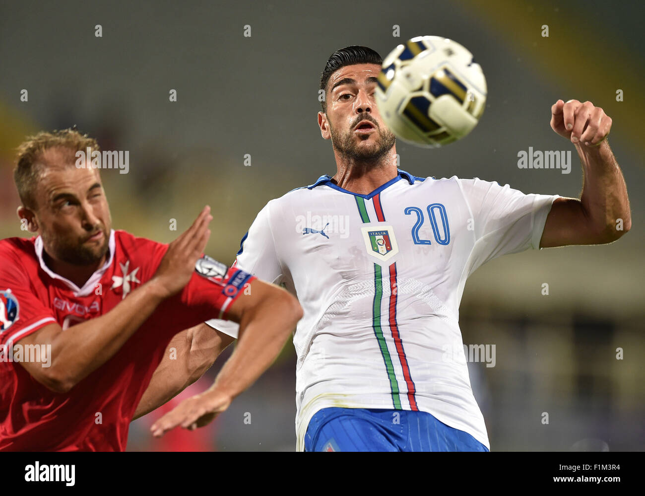 Florence, Italy. 3rd Sep, 2015. Graziano Pelle (R) of Italy vies with ...
