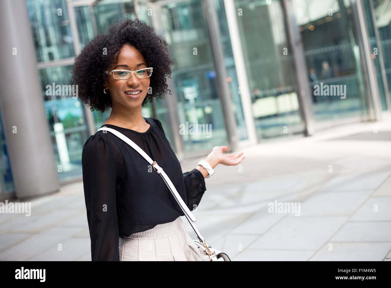 Woman young building entrance hi-res stock photography and images - Alamy