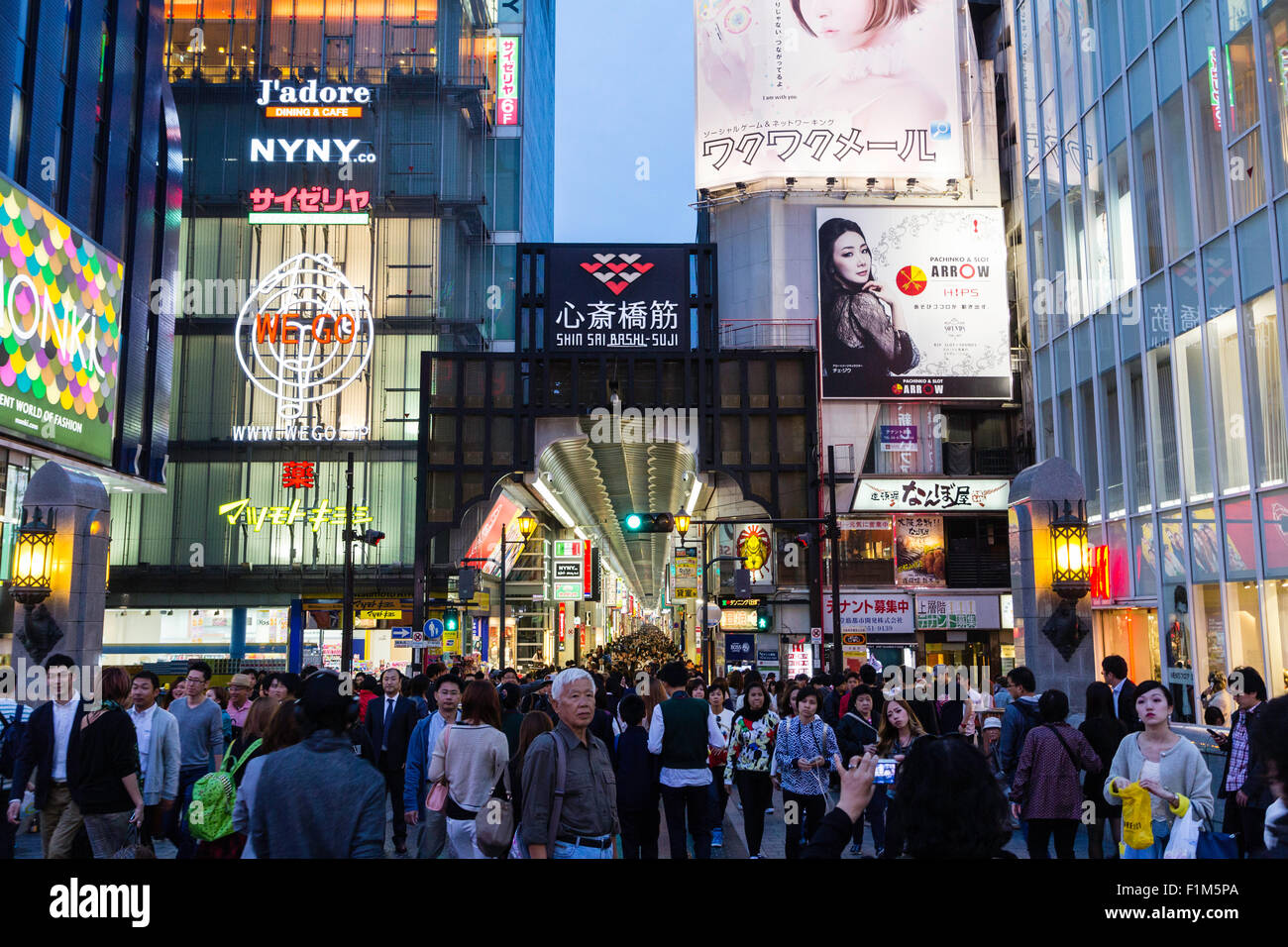 Ebisubashi bridge, packed with people during the evening blue hour with ...