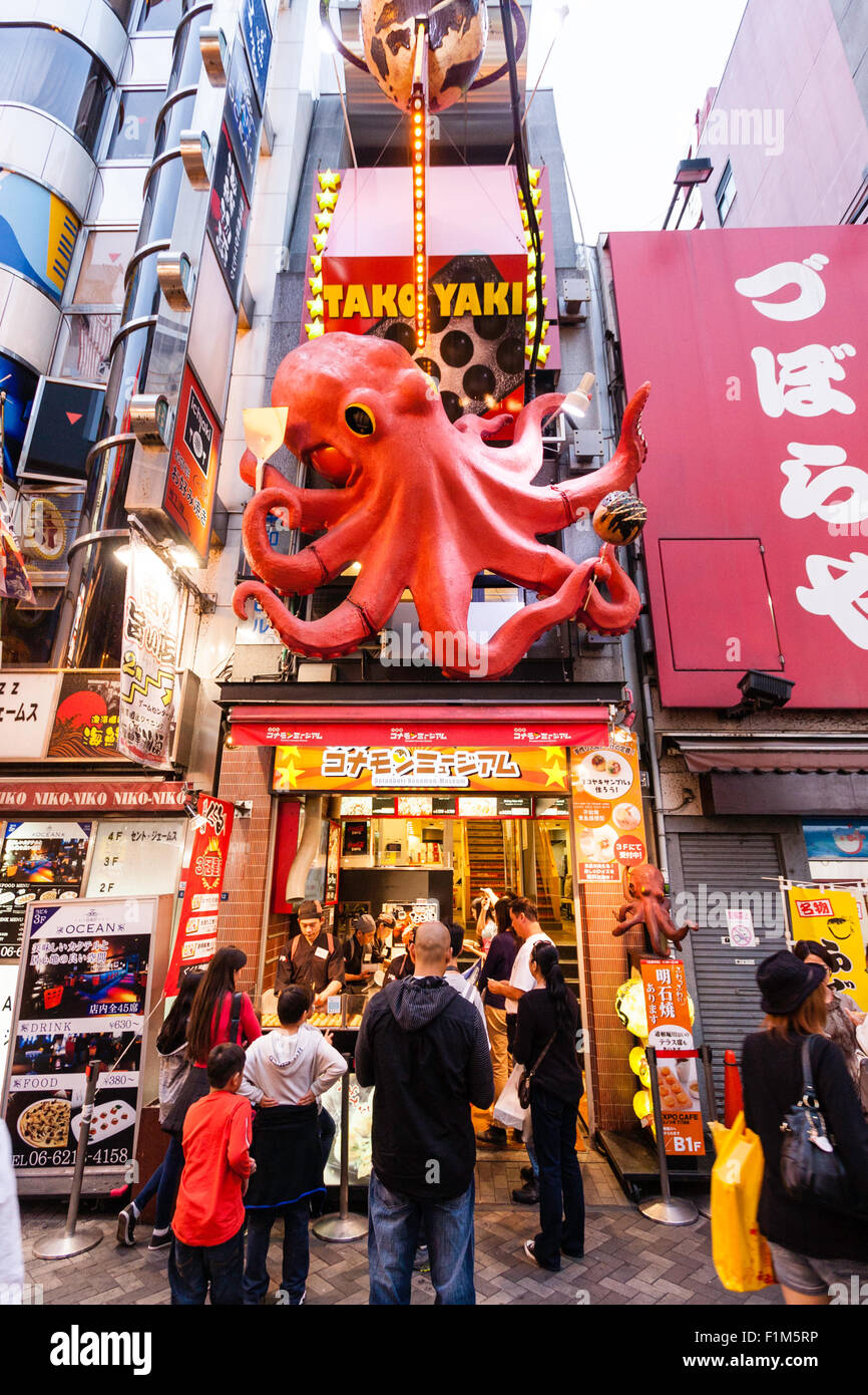 Japan, Osaka. Dotonbori. People outside Takoyaki restaurant, Dotonbori ...