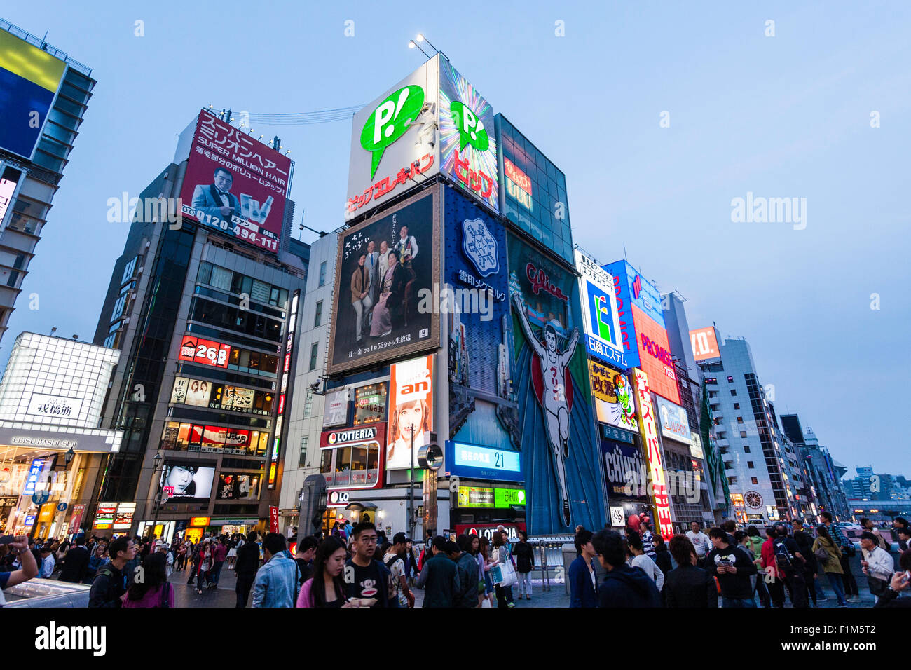 Japan, Osaka. Dotonbori, Ebisubashi bridge. View along buildings and ...