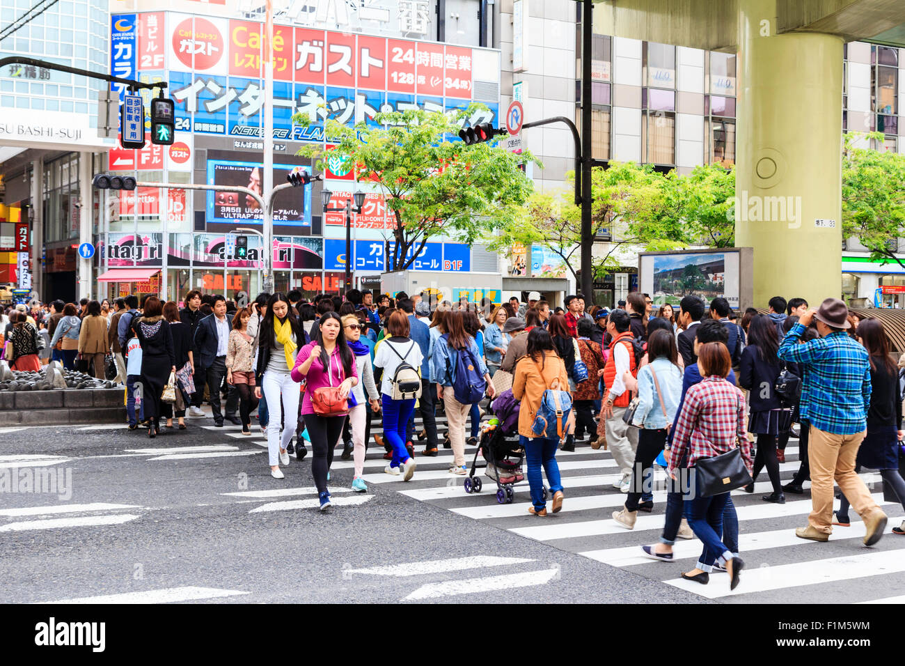 Japan, Osaka, Dotonbori. Busy scene of crowds of people on walking ...