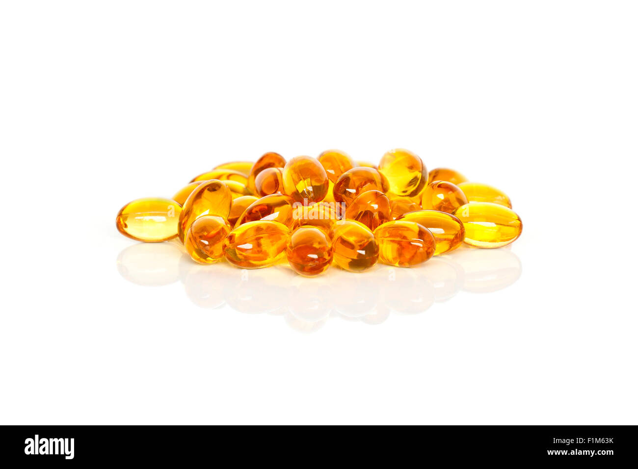 Vitamin supplement capsules closeup on a white background Stock Photo ...