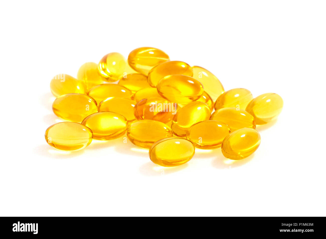 Vitamin supplement capsules closeup on a white background Stock Photo ...