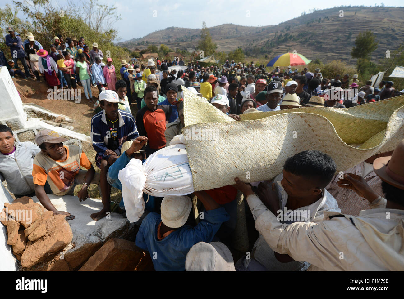 A corpse it taken out of t he tomb. Famadihana ( turning of the bones ...