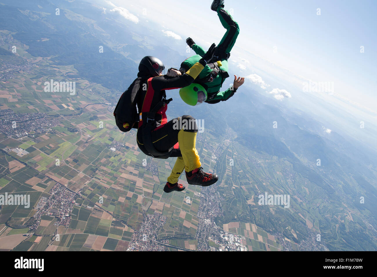 Freefly skydiving team is training formation back/sit-flying over a ...