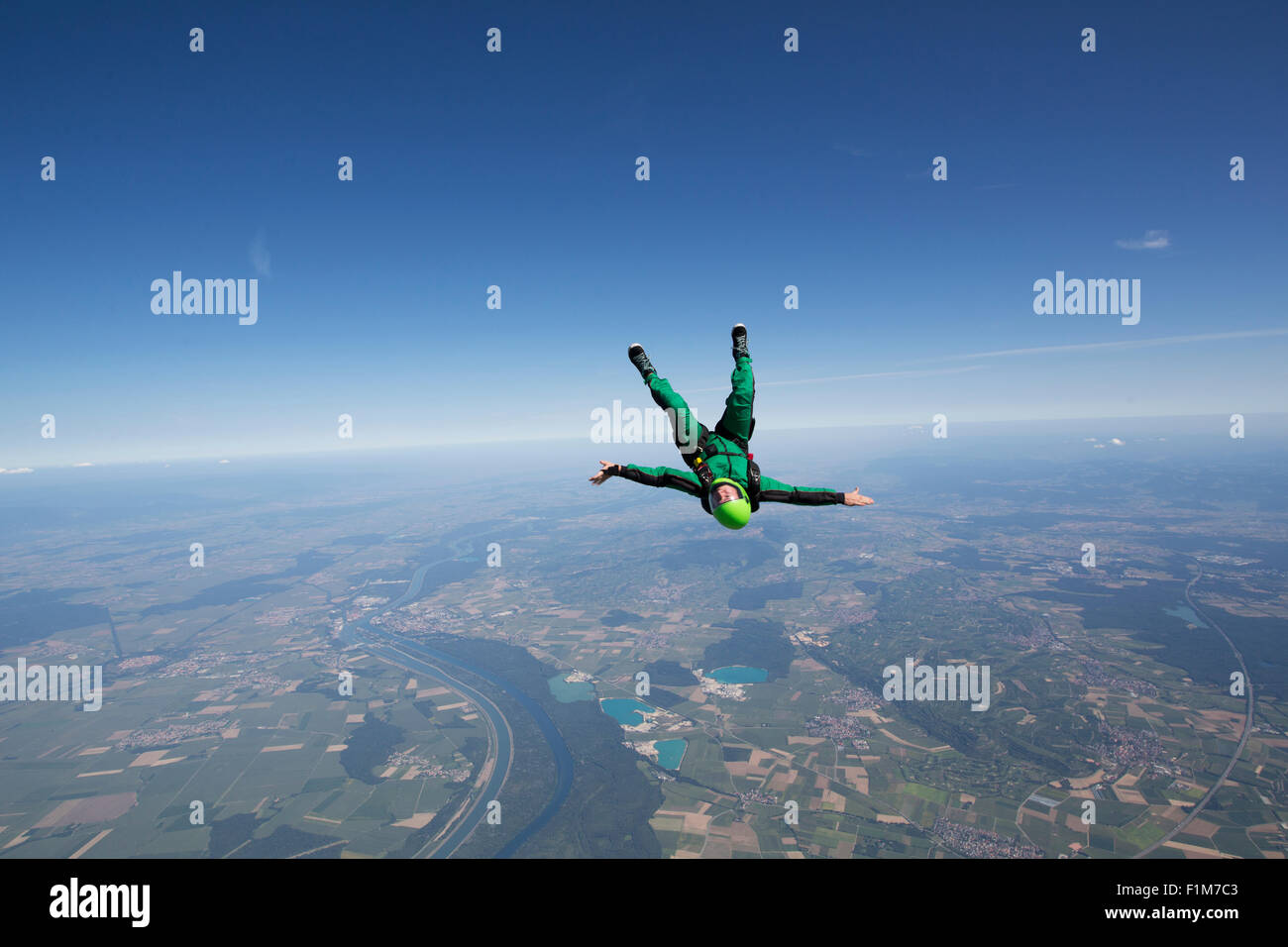 Freefly Skydiver is training freestyle body flight position in freefall ...