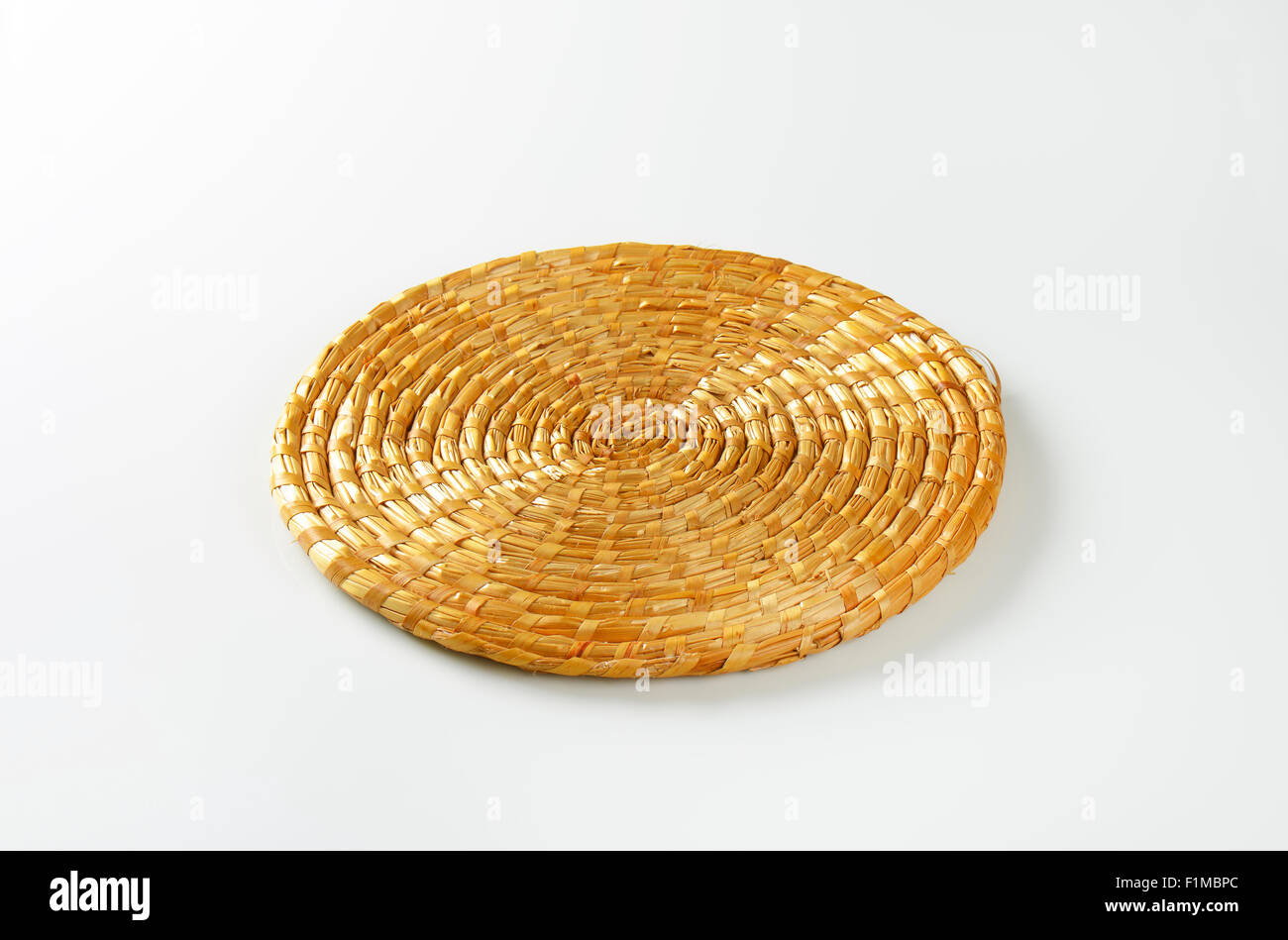 round wicker mat on white background Stock Photo - Alamy