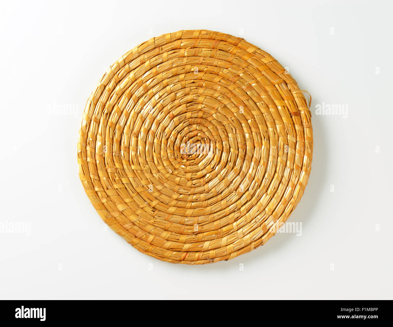 round wicker mat on white background Stock Photo - Alamy