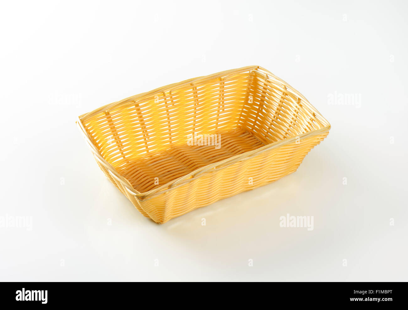 empty wicker bowl on white background Stock Photo - Alamy
