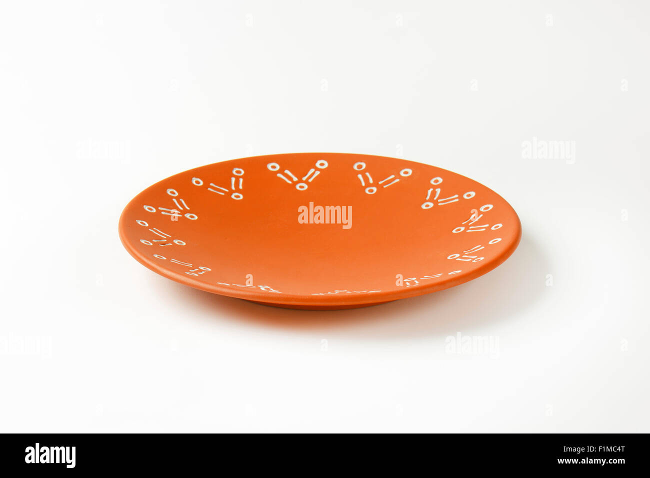 empty orange plate on white background Stock Photo - Alamy