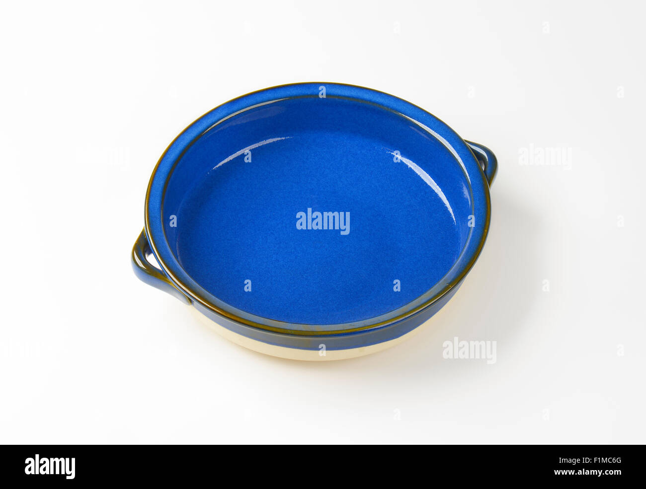 blue casserole dish on white background Stock Photo - Alamy