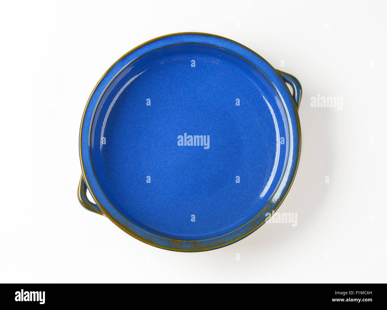 blue casserole dish on white background Stock Photo - Alamy