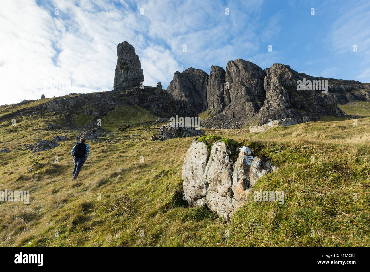 Man hiking through Scottish highlands in the Isle of Skye, Scotland ...