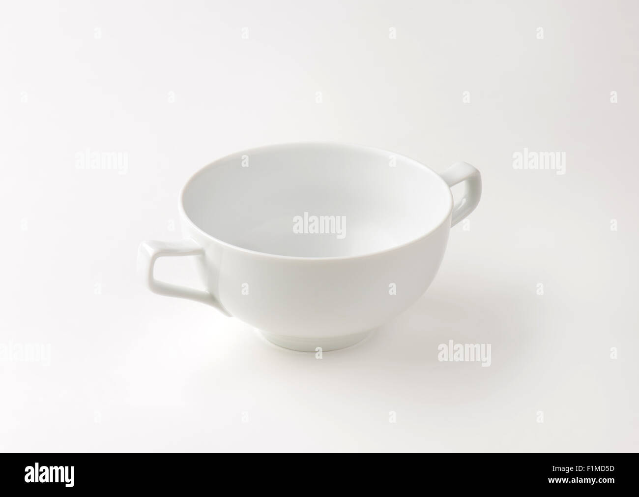 empty tea cup on white background Stock Photo - Alamy
