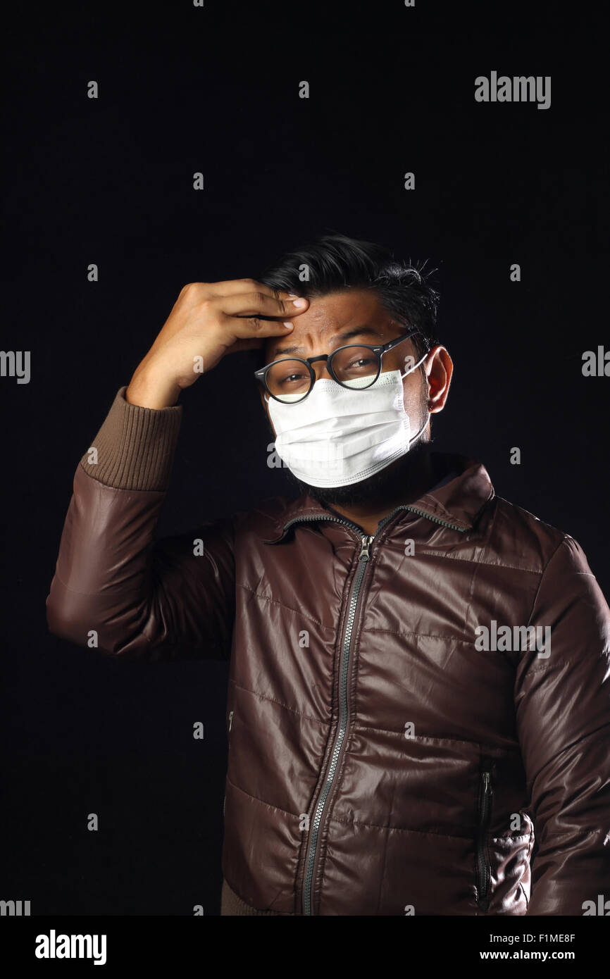 asian man wearing disposable face mask on black background Stock Photo ...