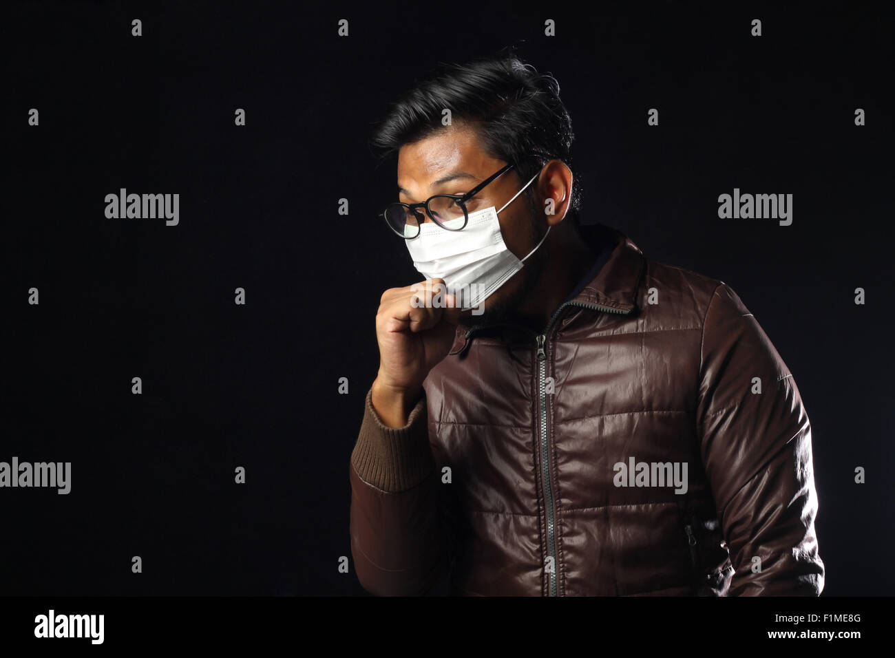 asian man wearing disposable face mask on black background Stock Photo ...