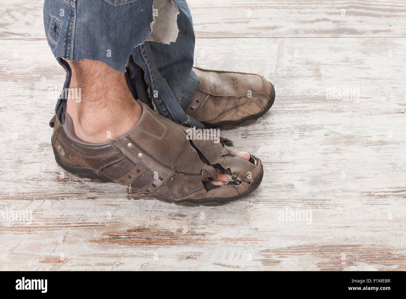 concept of a poor person and his feets Stock Photo - Alamy