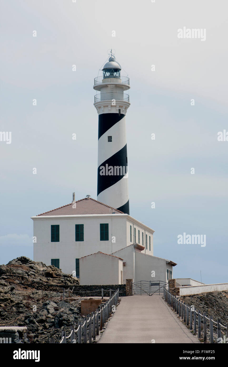 Lighthouse and surrounding buildings on a cliff edge in Minorca Stock ...