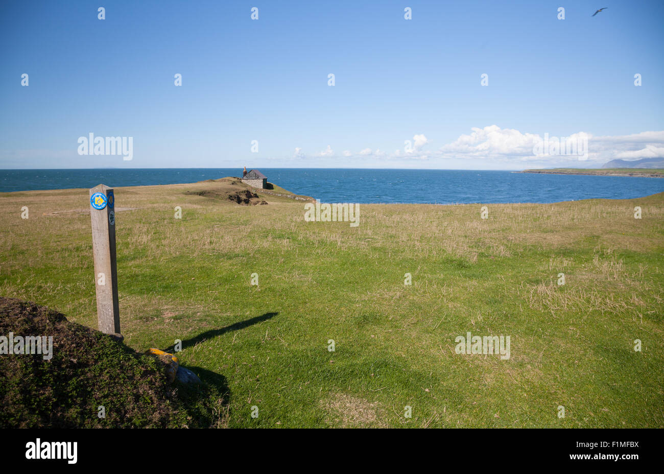 Wales coastal path / footpath waymarker post at the clifftop at Porth ...