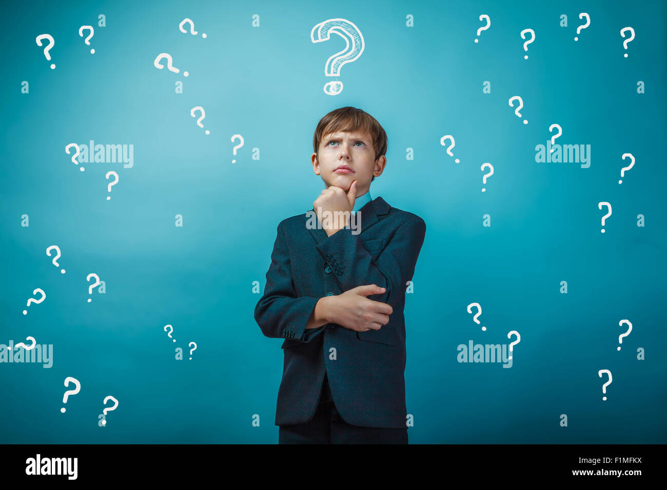 a boy of twelve European appearance in a suit holding a blank sh Stock ...