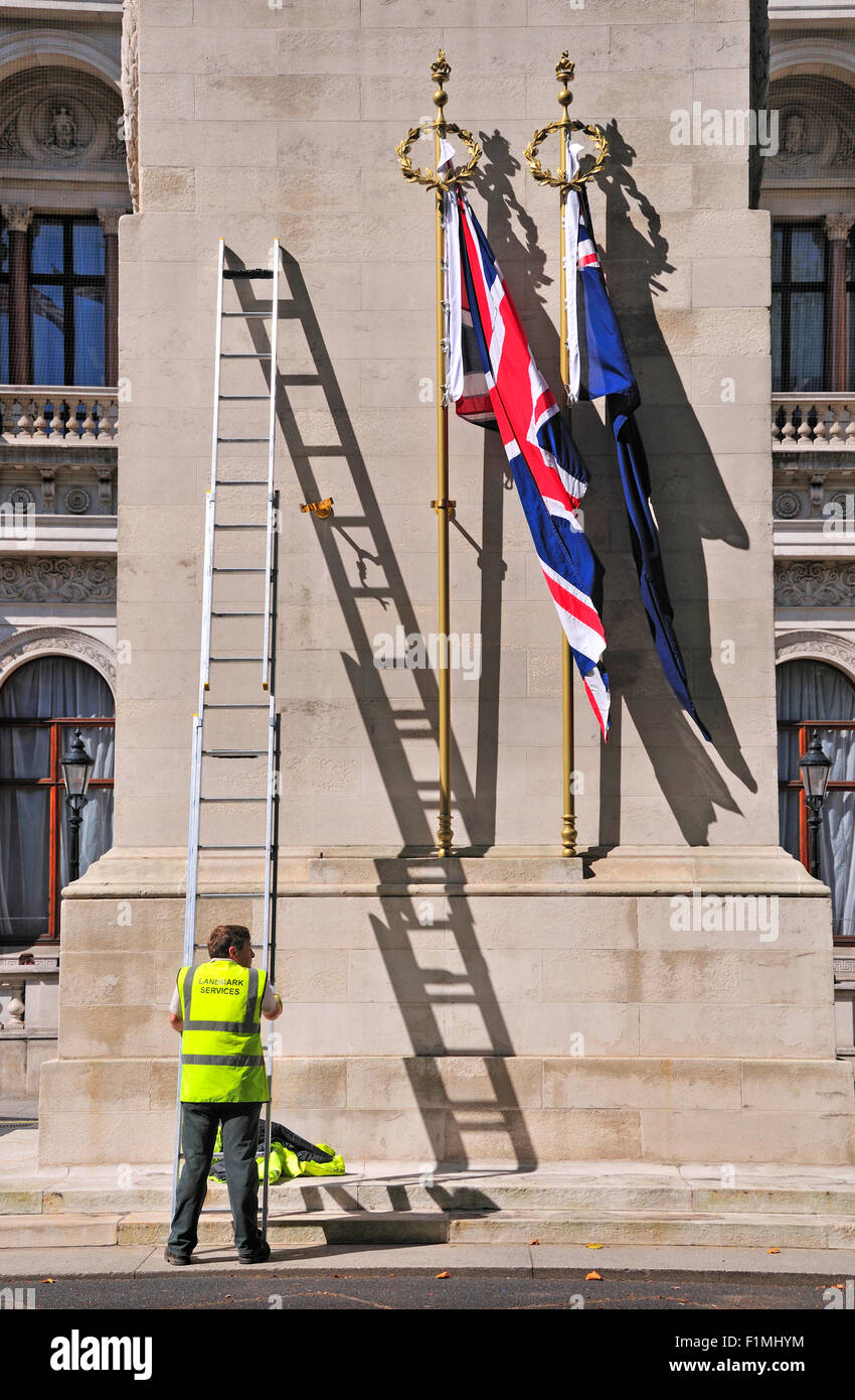 London, England, UK. Men changing the flags on the Cenotaph in ...