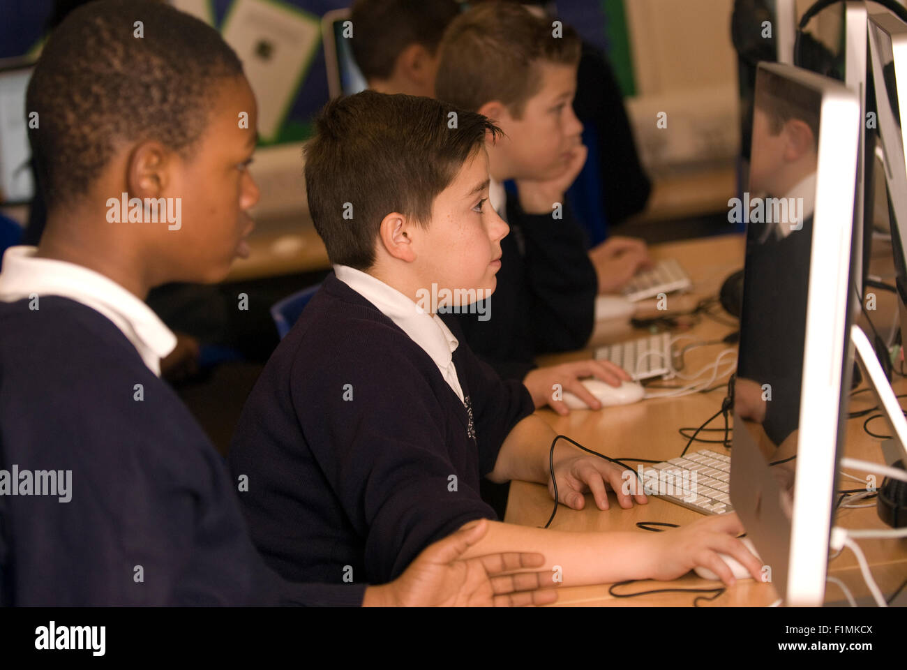 Primary school pupil's learning IT skills, London, UK Stock Photo - Alamy