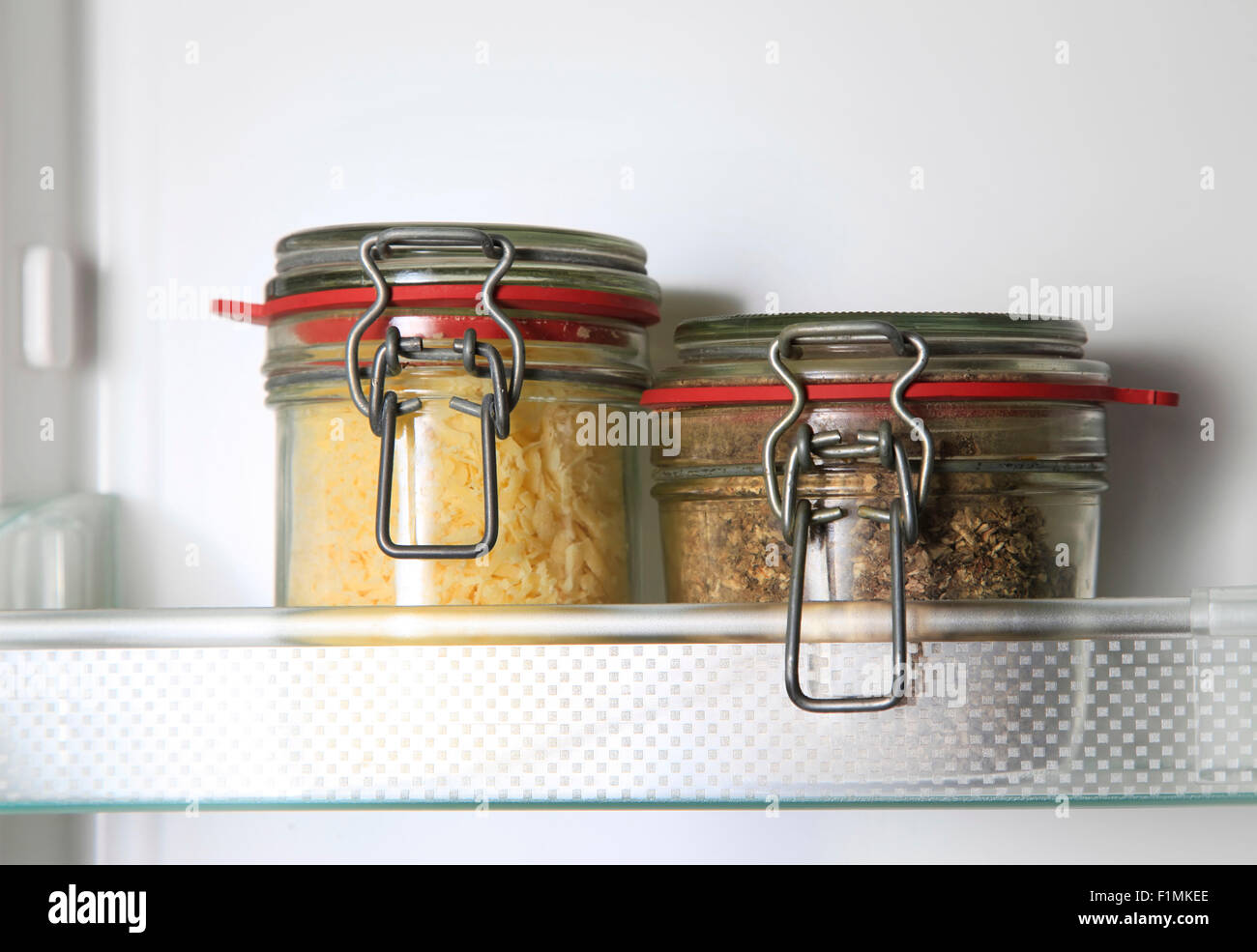 Glass jars on the shelf of the refrigerator Stock Photo - Alamy