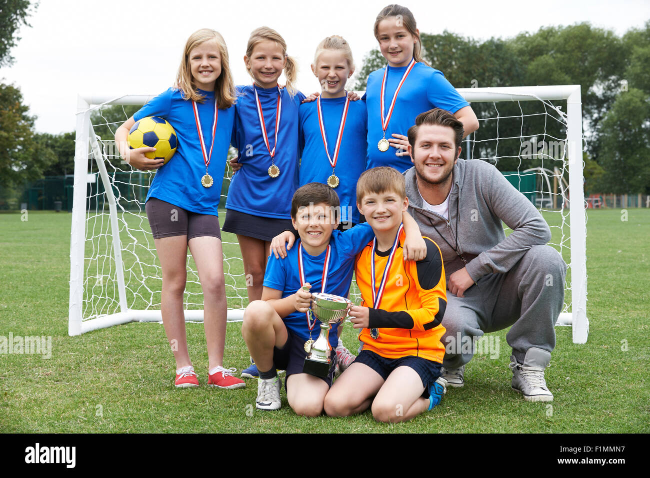Girl winning trophy hi-res stock photography and images - Alamy