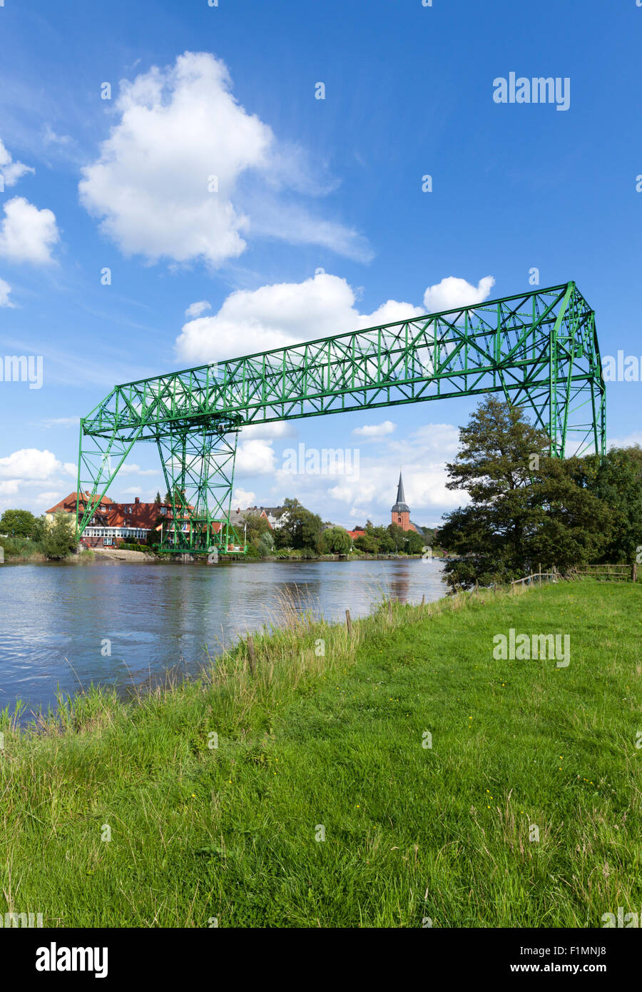 Historic transporter bridge across the Oste river and Osten village ...