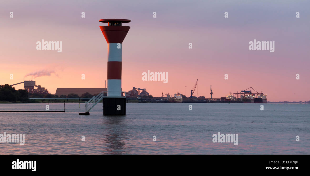 Lighthouse, industrial plants and harbor at Stade-Bützfleth on the Elbe ...