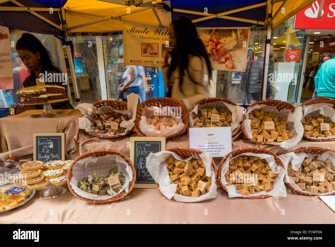 A female stall holder on a cake and fudge stall at Wolverhampton Street ...