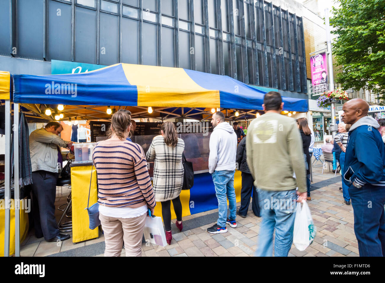 people queuing at a food stall at Wolverhampton Street market west ...