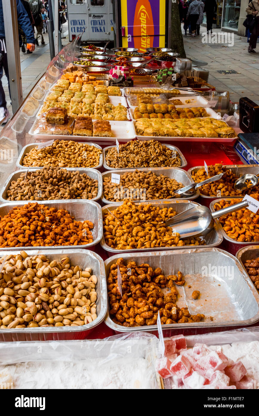 A man selling a variety of nuts and pastries at Wolverhampton Street ...