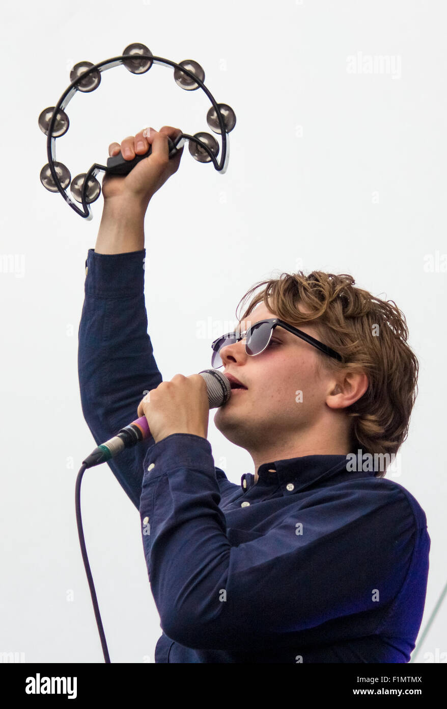 Rowan Bastable of Kassassin Street holding a tambourine in the air and ...