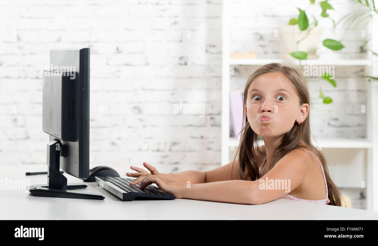 a girl grimaced front of a computer Stock Photo - Alamy