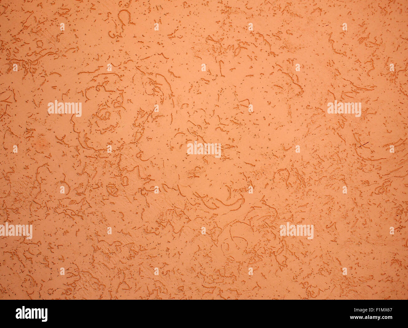 Abstract design of short curved lines on a beige wall plastered Stock ...