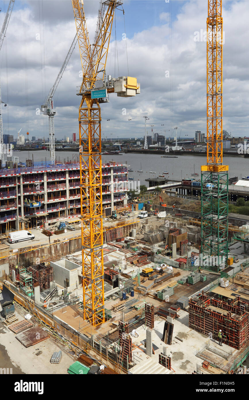A large apartment block under construction overlooking the River Thames ...