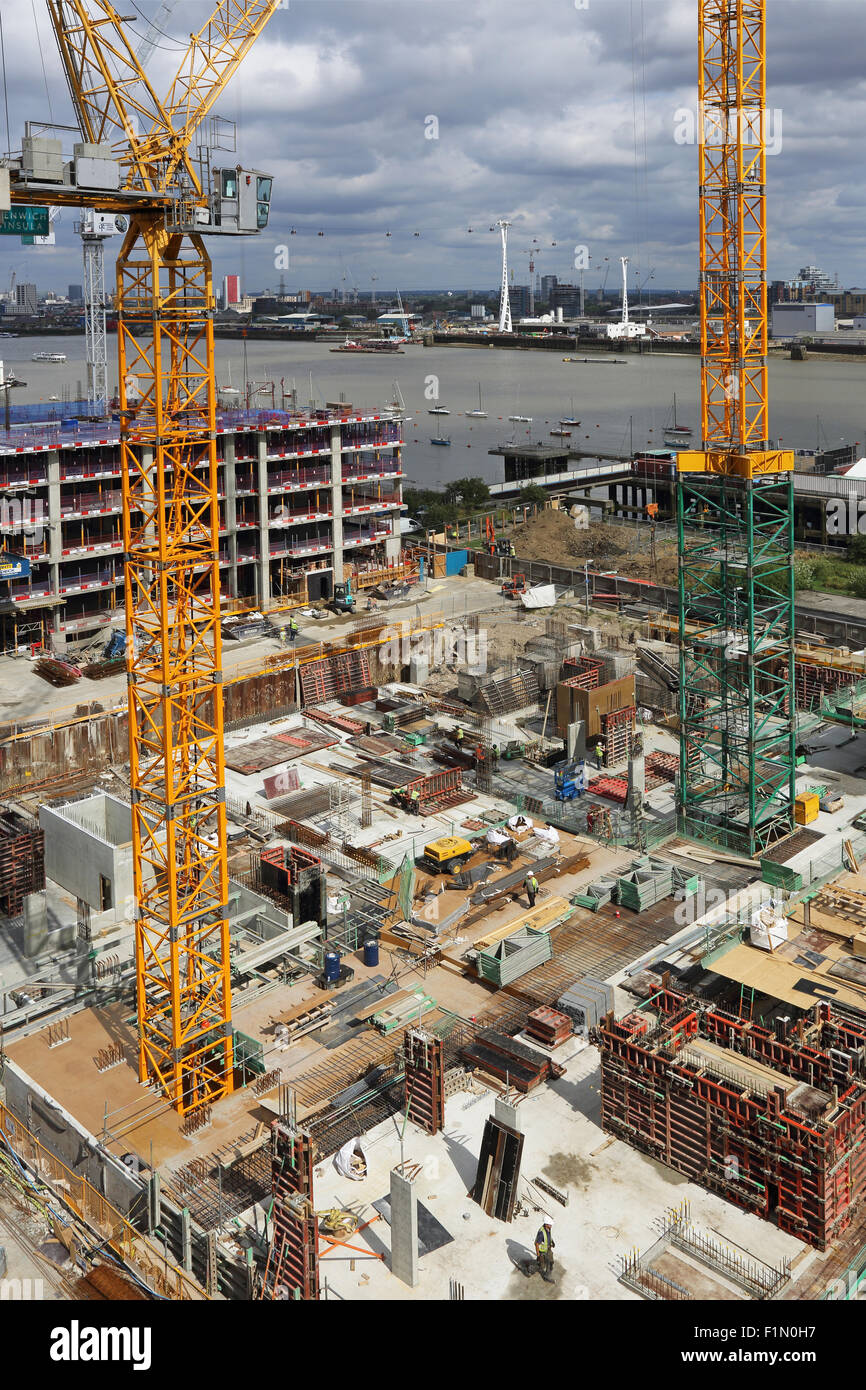 A large apartment block under construction overlooking the River Thames ...