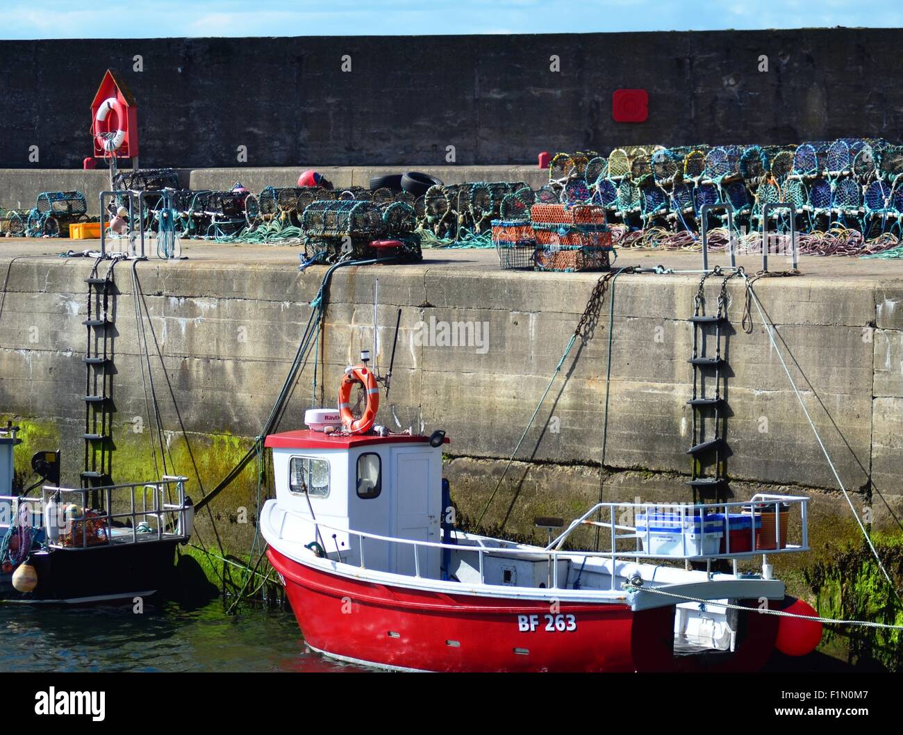 Fishing boat in harbour in Findochty, a Scottish fishing village Stock ...
