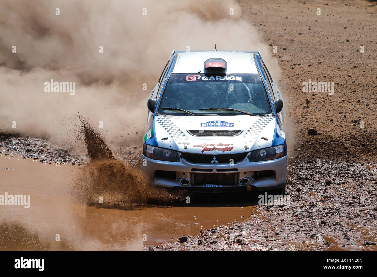 ISTANBUL, TURKEY - JULY 26, 2015: Osman Ugur drives Mitsubishi Lancer ...