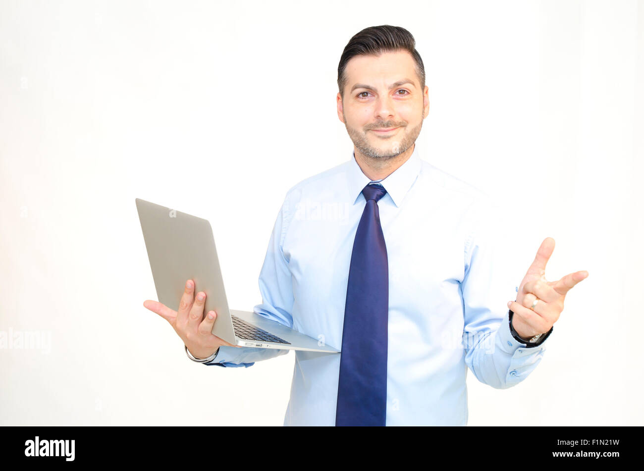 Business man holding a laptop isolated on white background Stock Photo ...