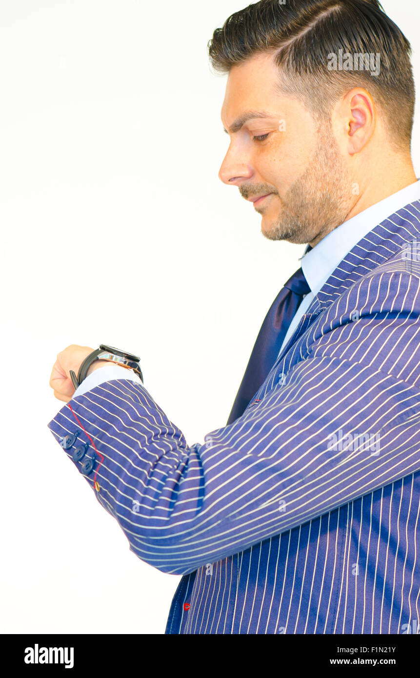 Business man looking at his watch islolated on white background Stock ...