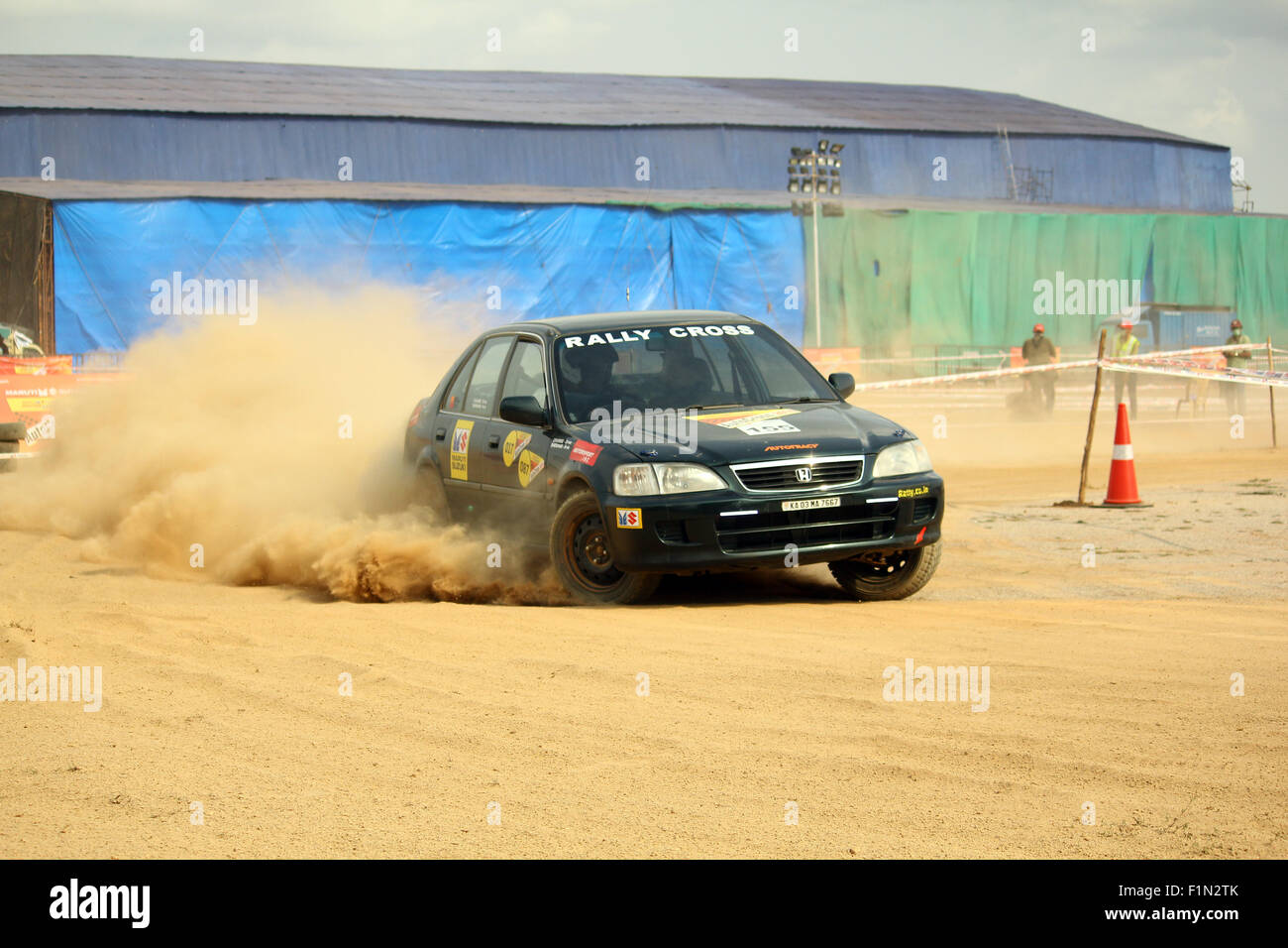 Cars drifting in mud at the Autocross 2014, bangalore, India Stock ...